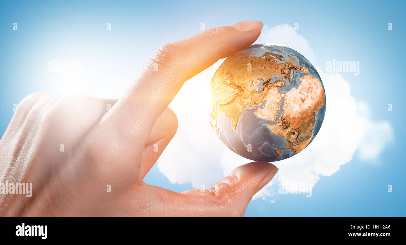 Small Earth planet ball between female fingers. Elements of this image ...