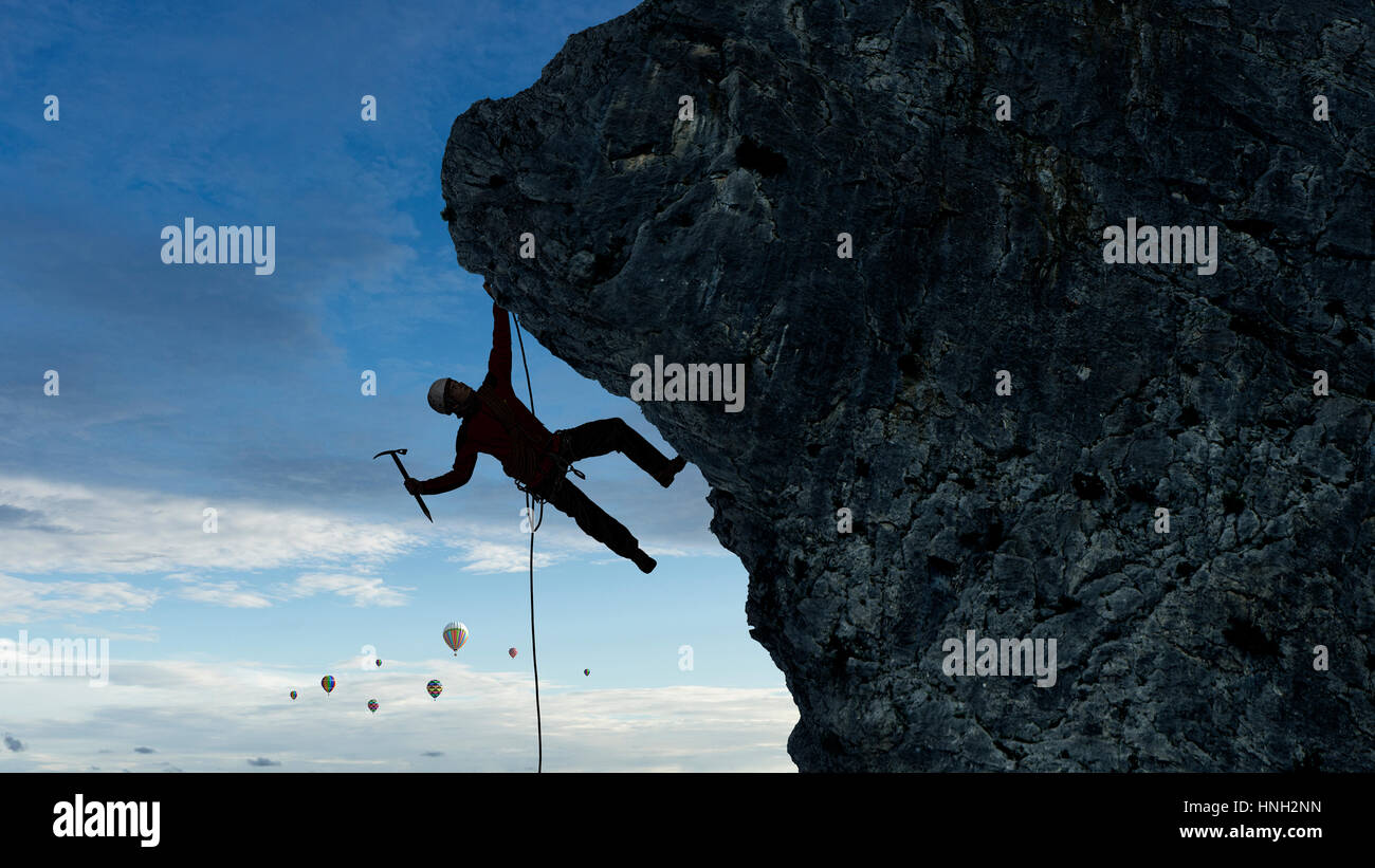 Young brave man alpinist climbing dangerous cliff Stock Photo - Alamy