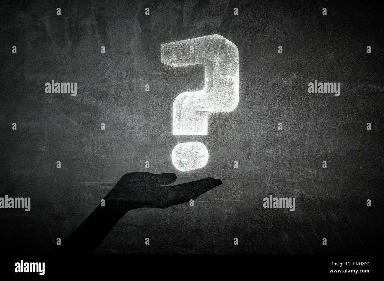 Hand holding question mark on concrete background Stock Photo - Alamy