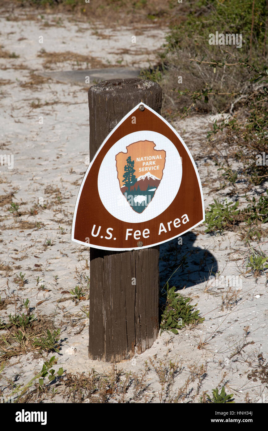 US fee area sign mounted on a wooden post at a camping site in Fort ...