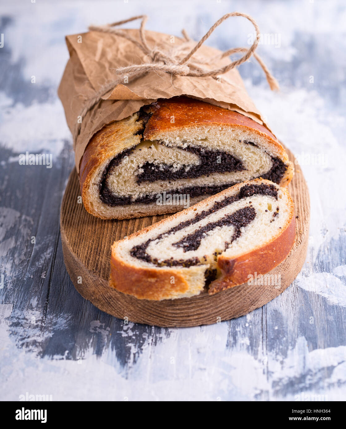 Close up of a traditional polish roll stuffed with poppy seed filling ...