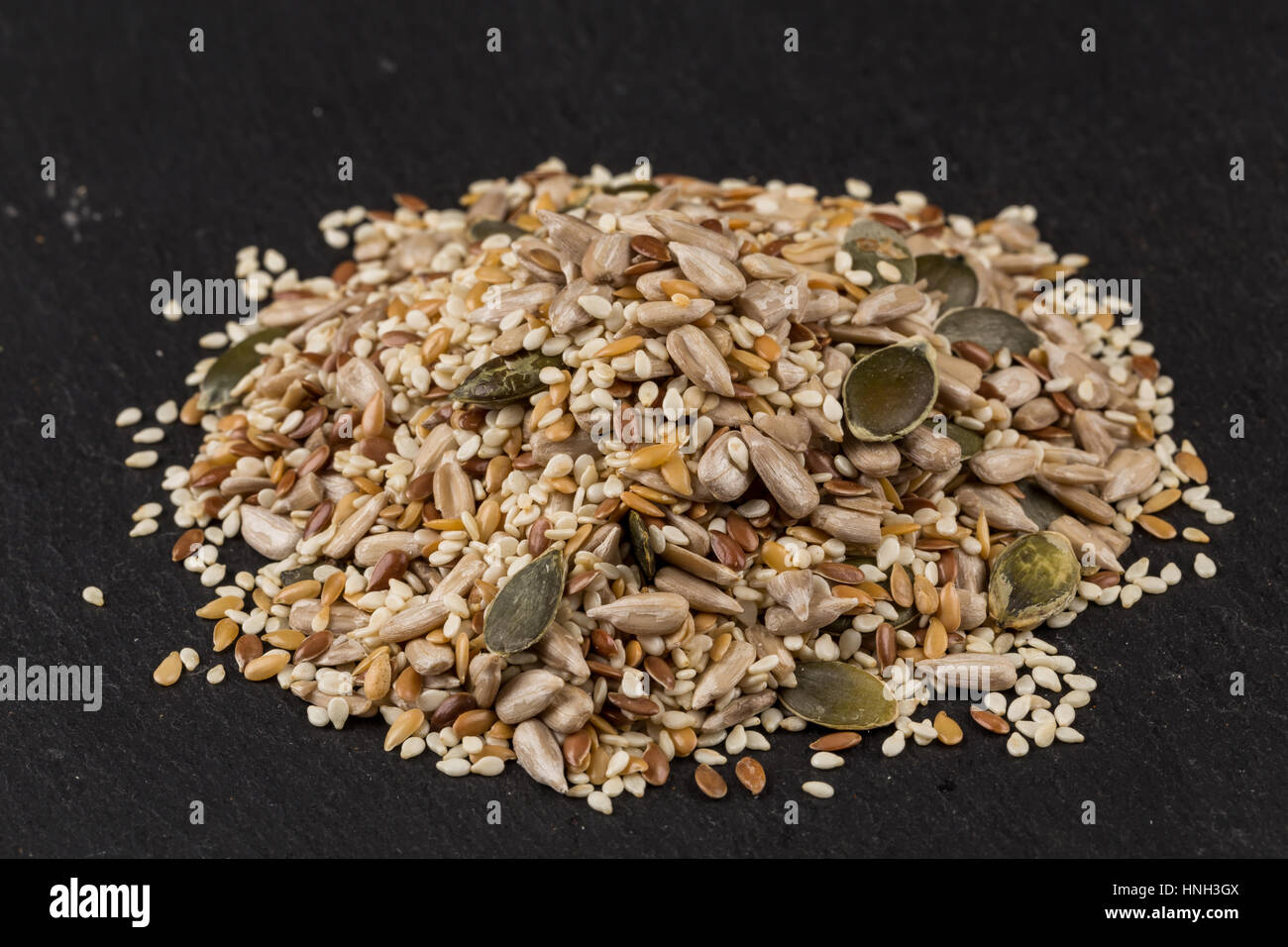 Healthy seeds mix on a stone background Stock Photo - Alamy