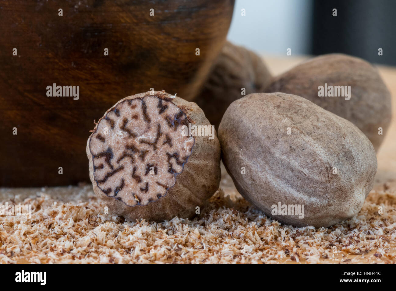 Close Up of Whole Nutmeg and Ground Nutmeg on butcher block Stock Photo ...