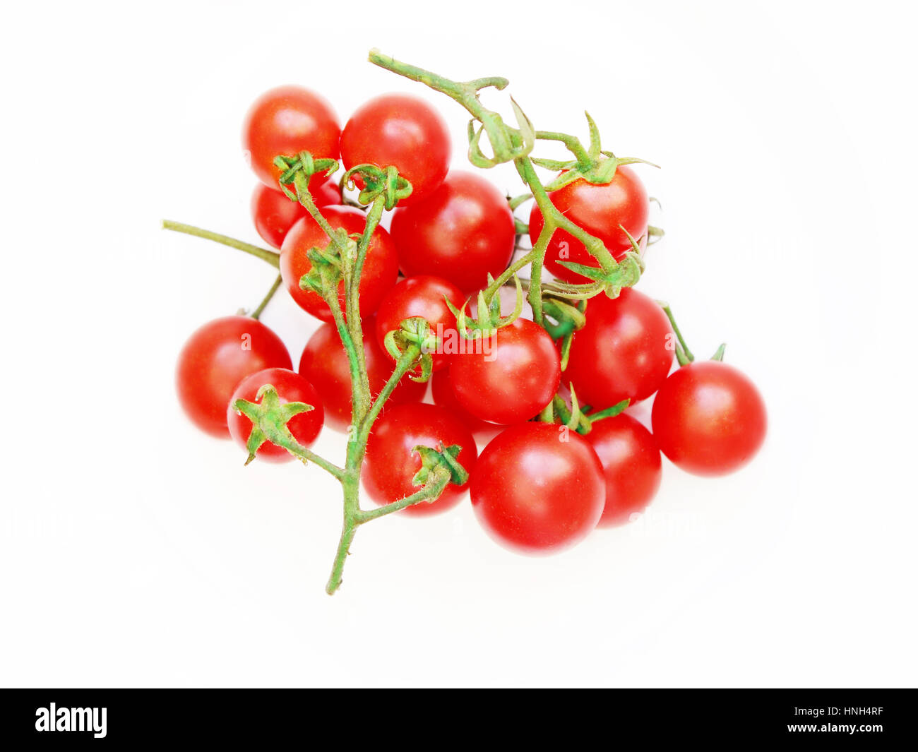heap with branches of fresh red tomatoes isolated on the white Stock ...
