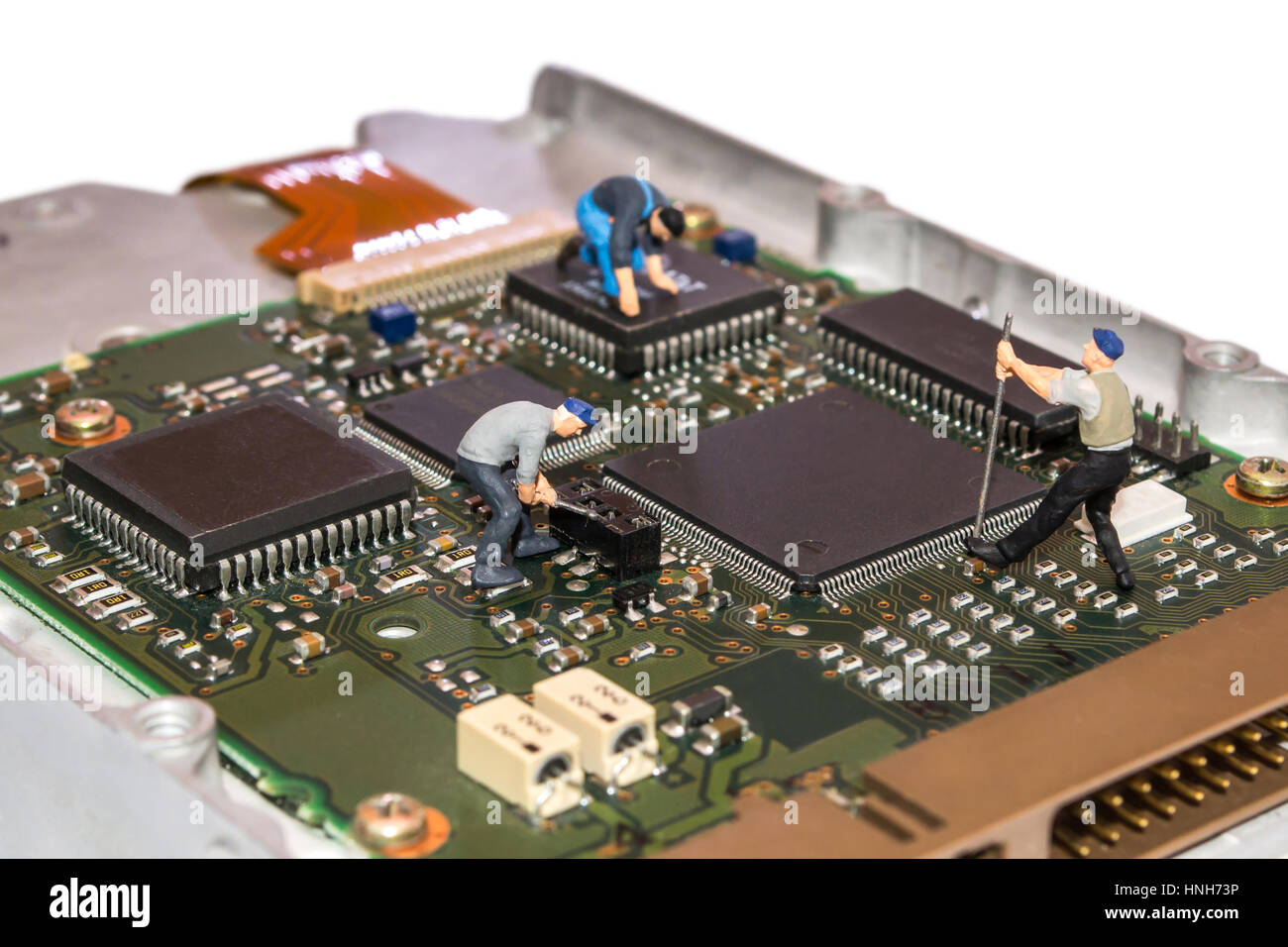 Miniature people repairing the hard drive A broken computer equipment ...