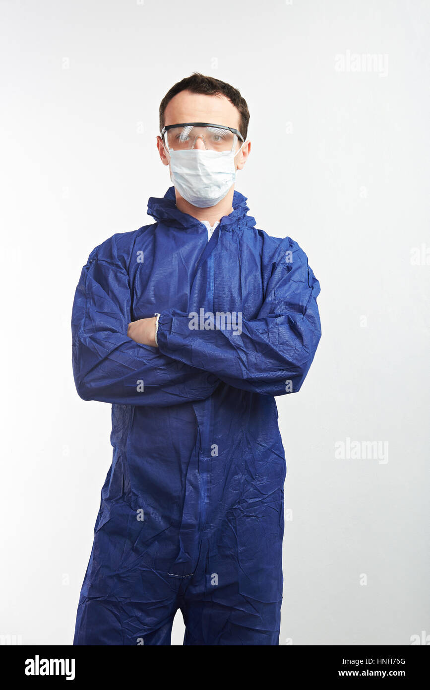working in protective uniform with crossed arms isolated on white ...