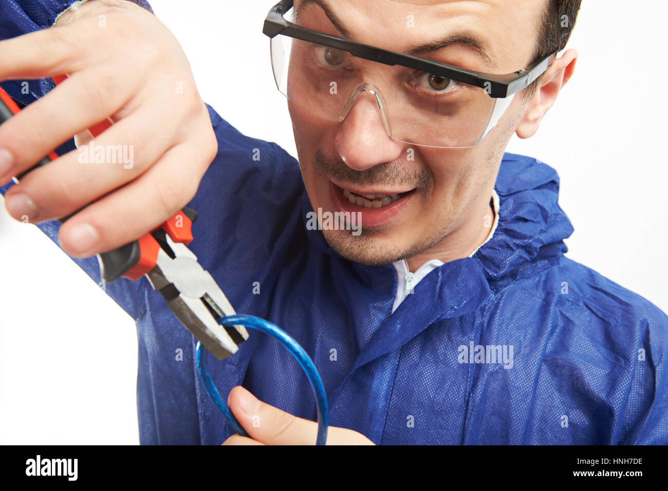 Man cutting electrical wire hi-res stock photography and images - Alamy
