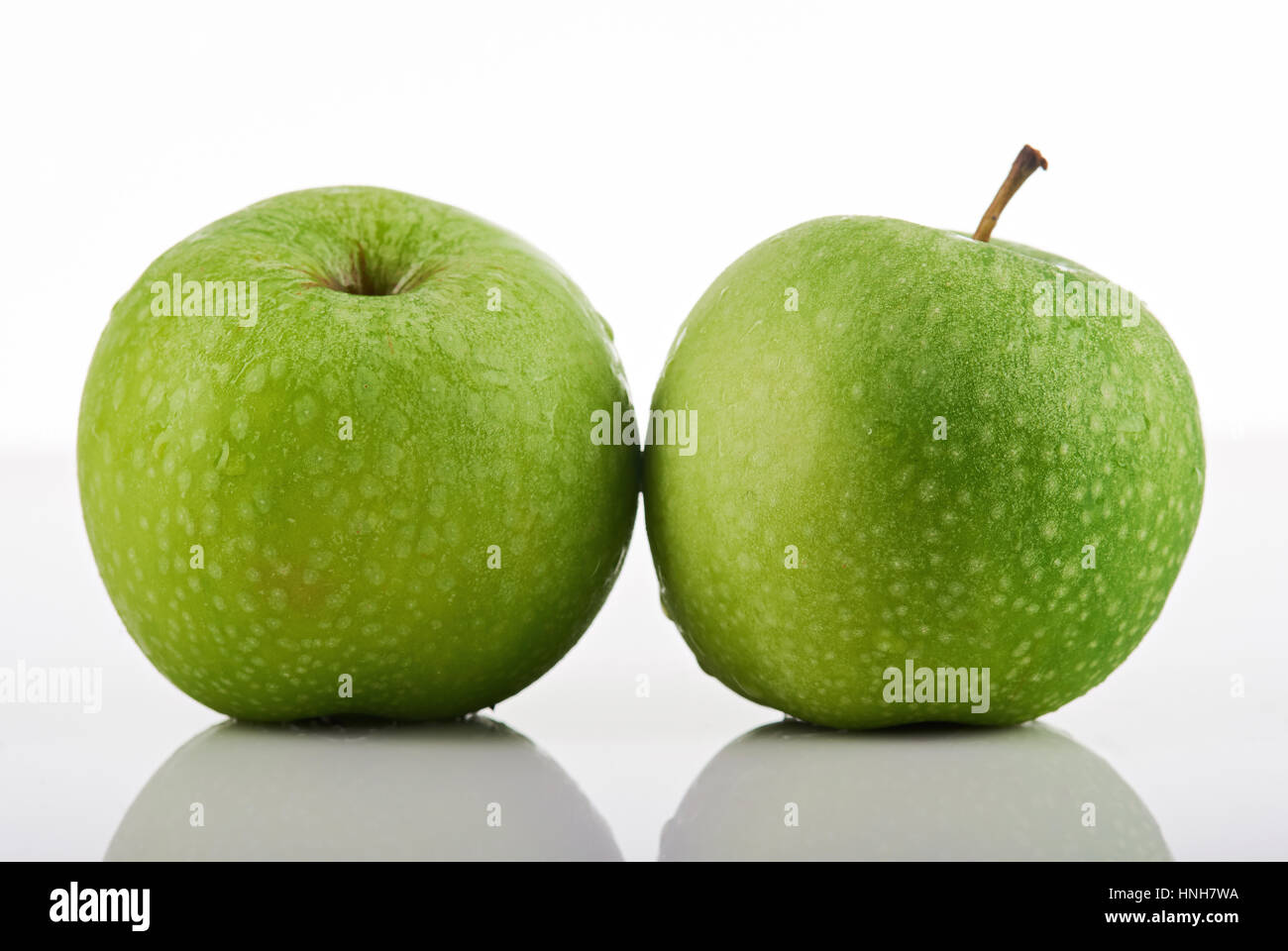 two green apples isolated on hite background Stock Photo - Alamy