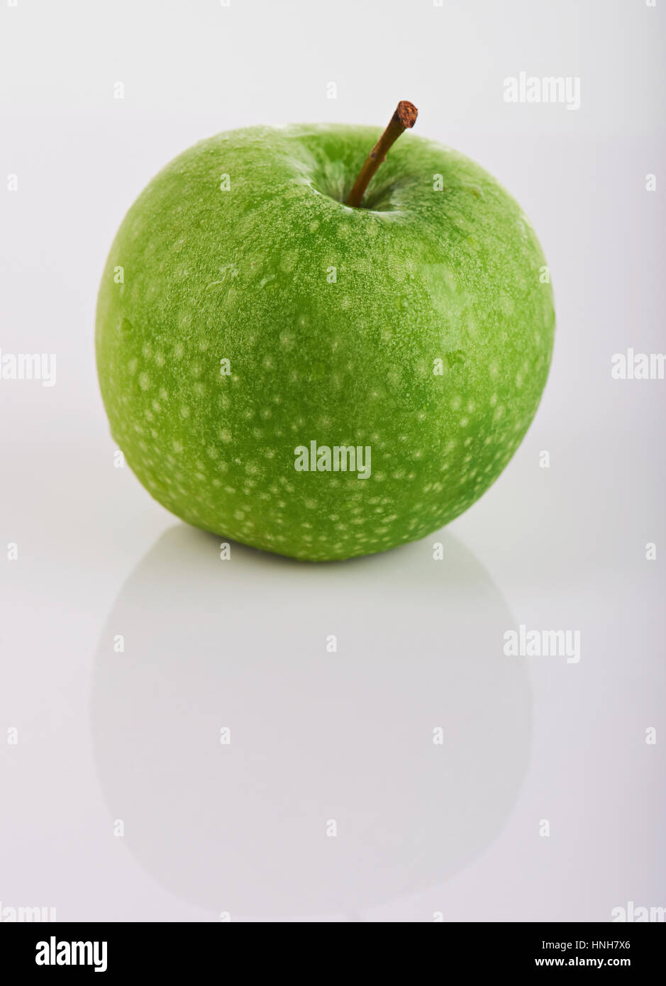 One wet green apple isolated on white background Stock Photo - Alamy