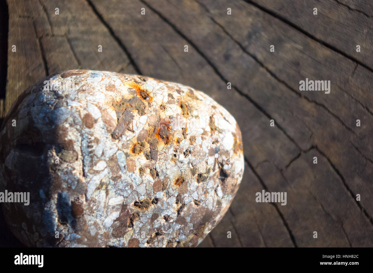Spa beautiful and unusual decorative pebbles on the old cracked wooden ...
