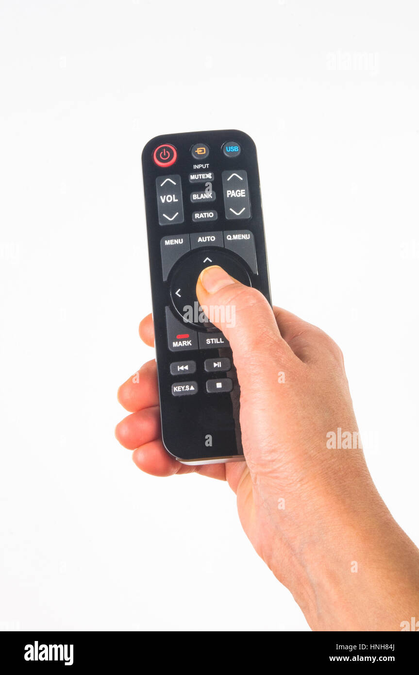 hand holding a remote control on white background Stock Photo - Alamy