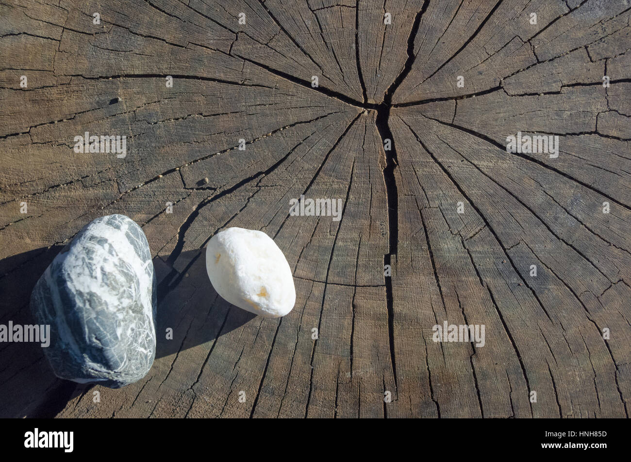 Spa beautiful and unusual decorative pebbles on the old cracked wooden ...