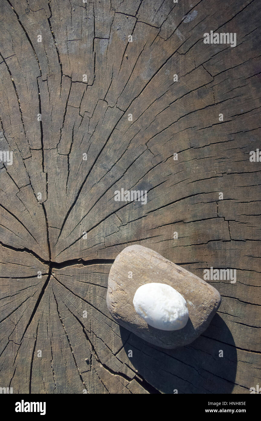 Spa beautiful and unusual decorative pebbles on the old cracked wooden ...