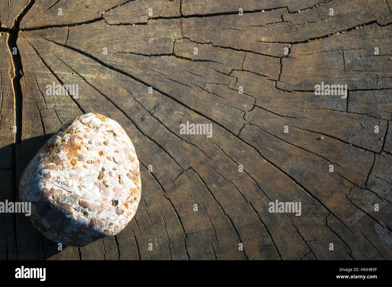 Spa beautiful and unusual decorative pebbles on the old cracked wooden ...