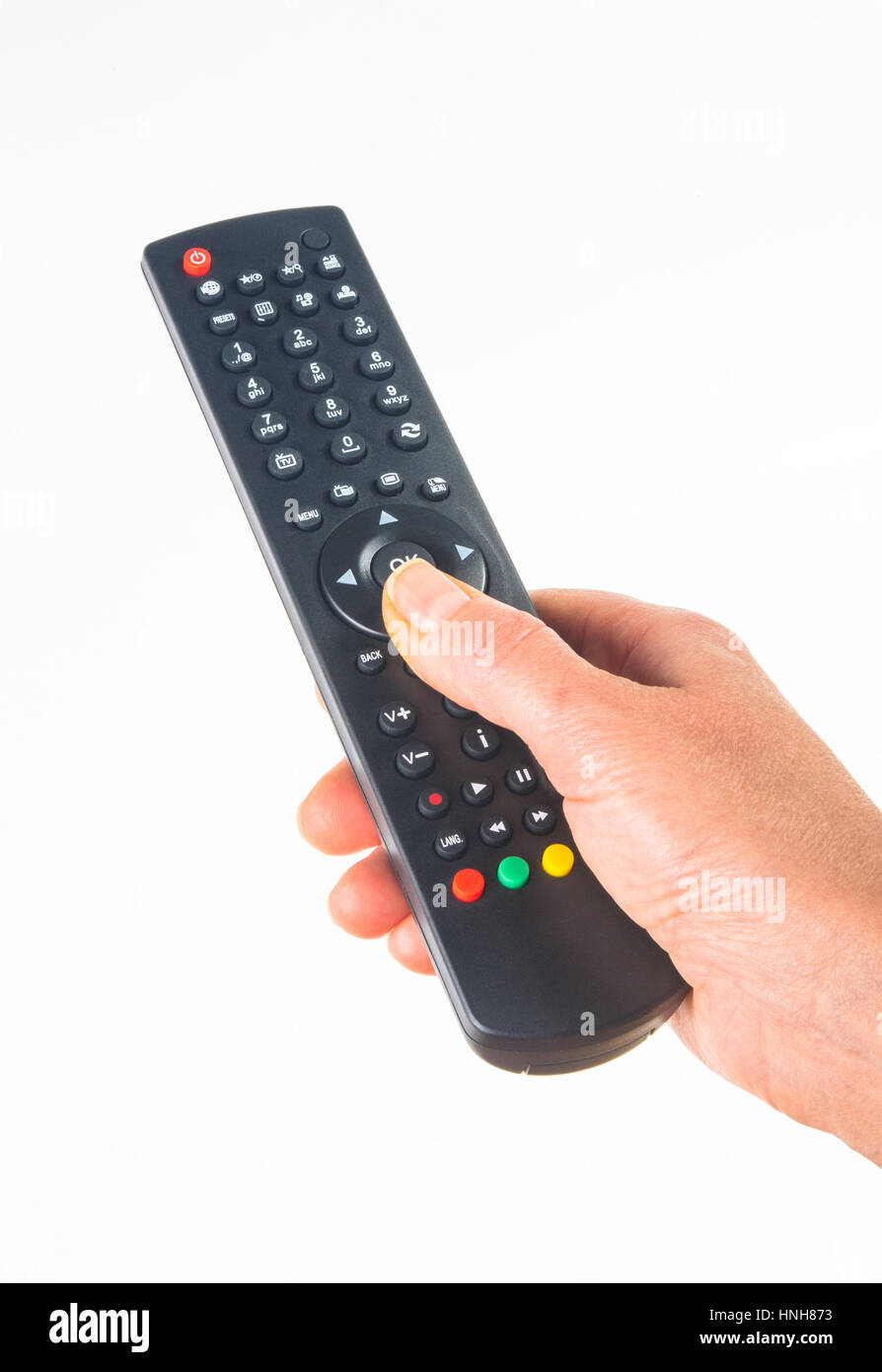hand holding a remote control on white background Stock Photo - Alamy