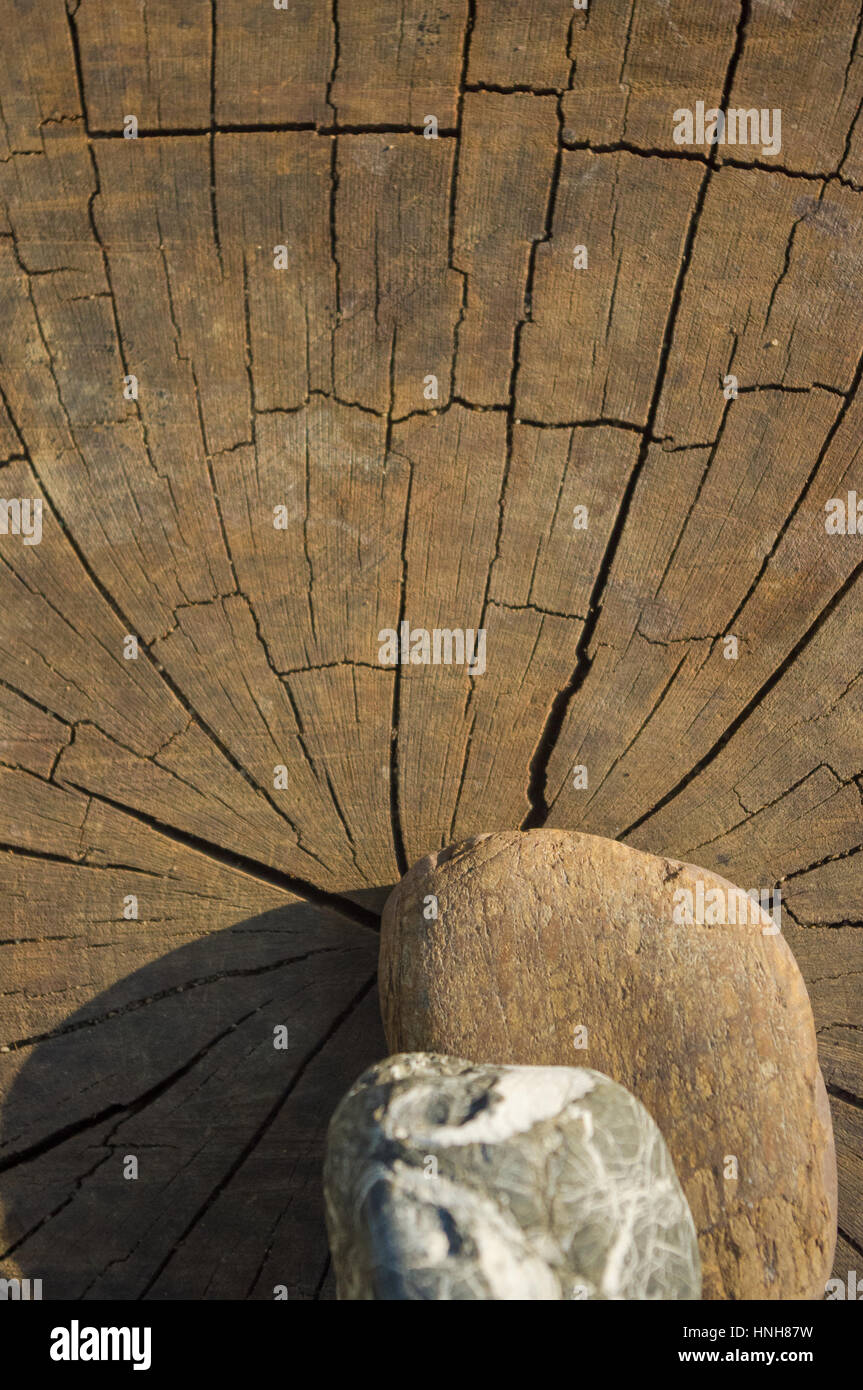 Spa beautiful and unusual decorative pebbles on the old cracked wooden ...