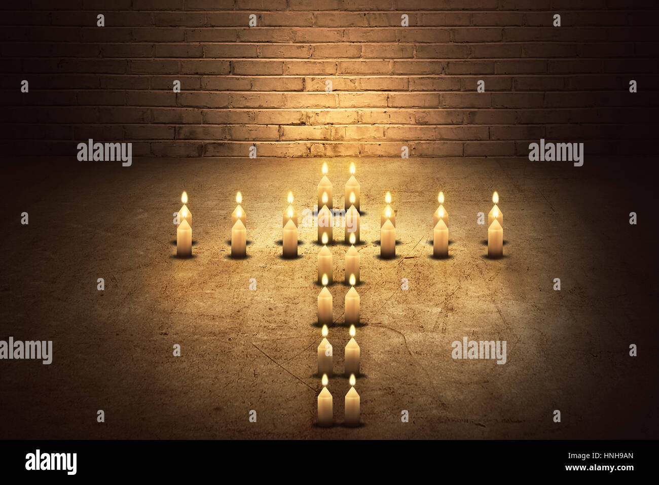 Burning candles in the form of a cross on the dark room Stock Photo - Alamy