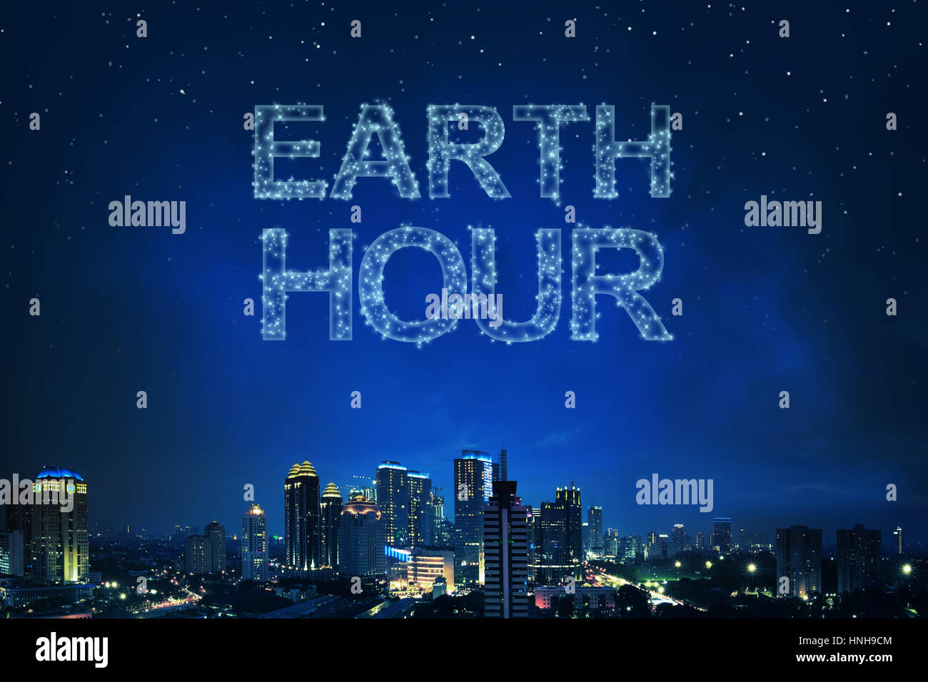 Earth Hour greeting from light the star on skyline above night city ...