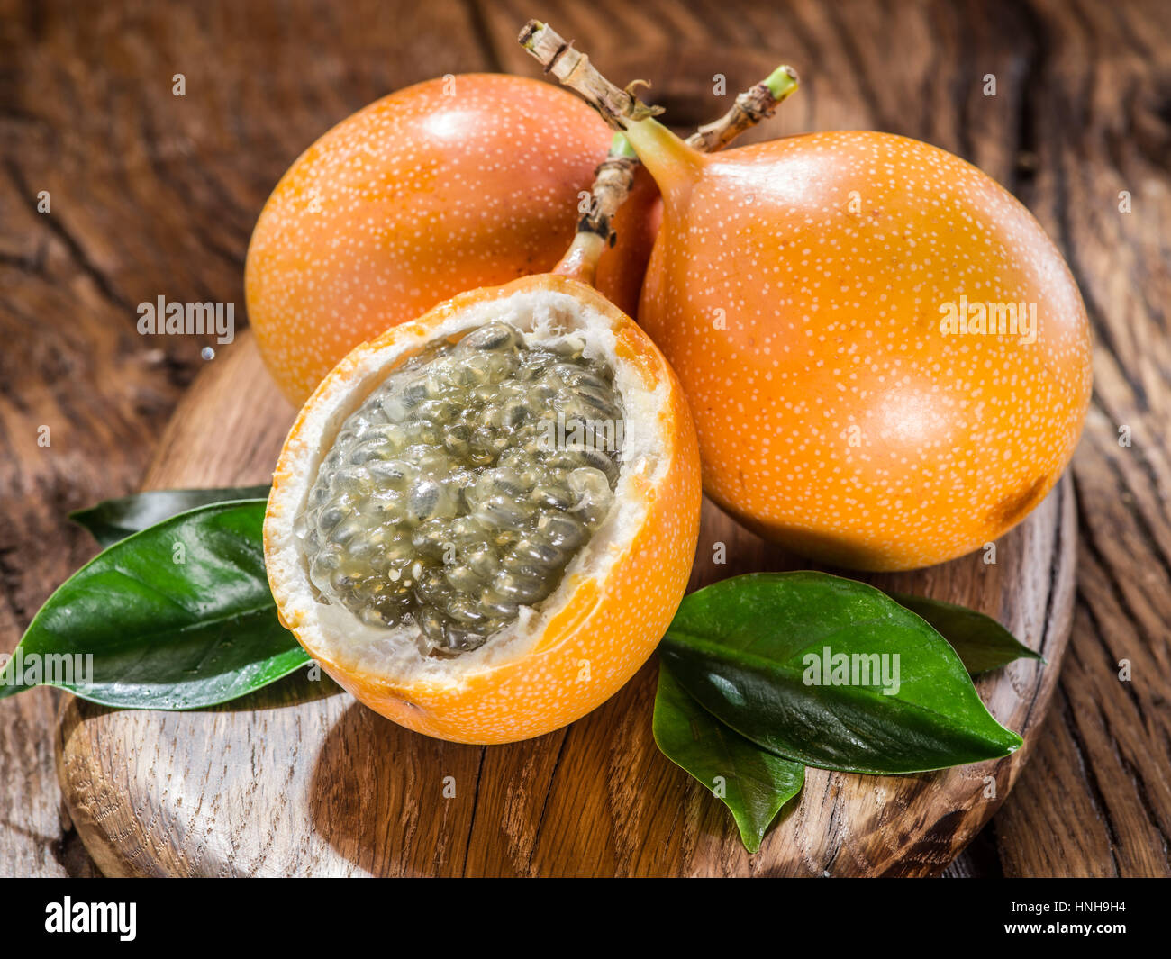 Granadilla fruits on the wooden table Stock Photo - Alamy