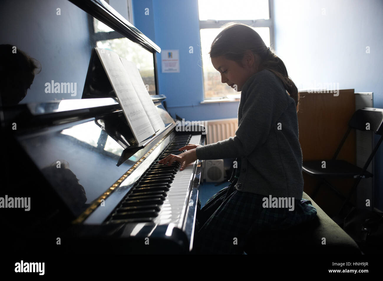 playing piano in school Stock Photo - Alamy
