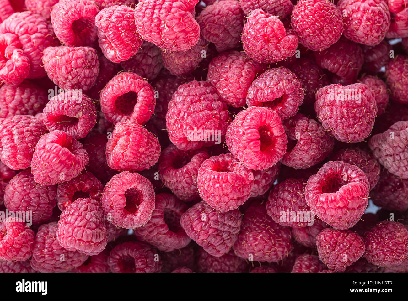 Raspberries background hi-res stock photography and images - Alamy