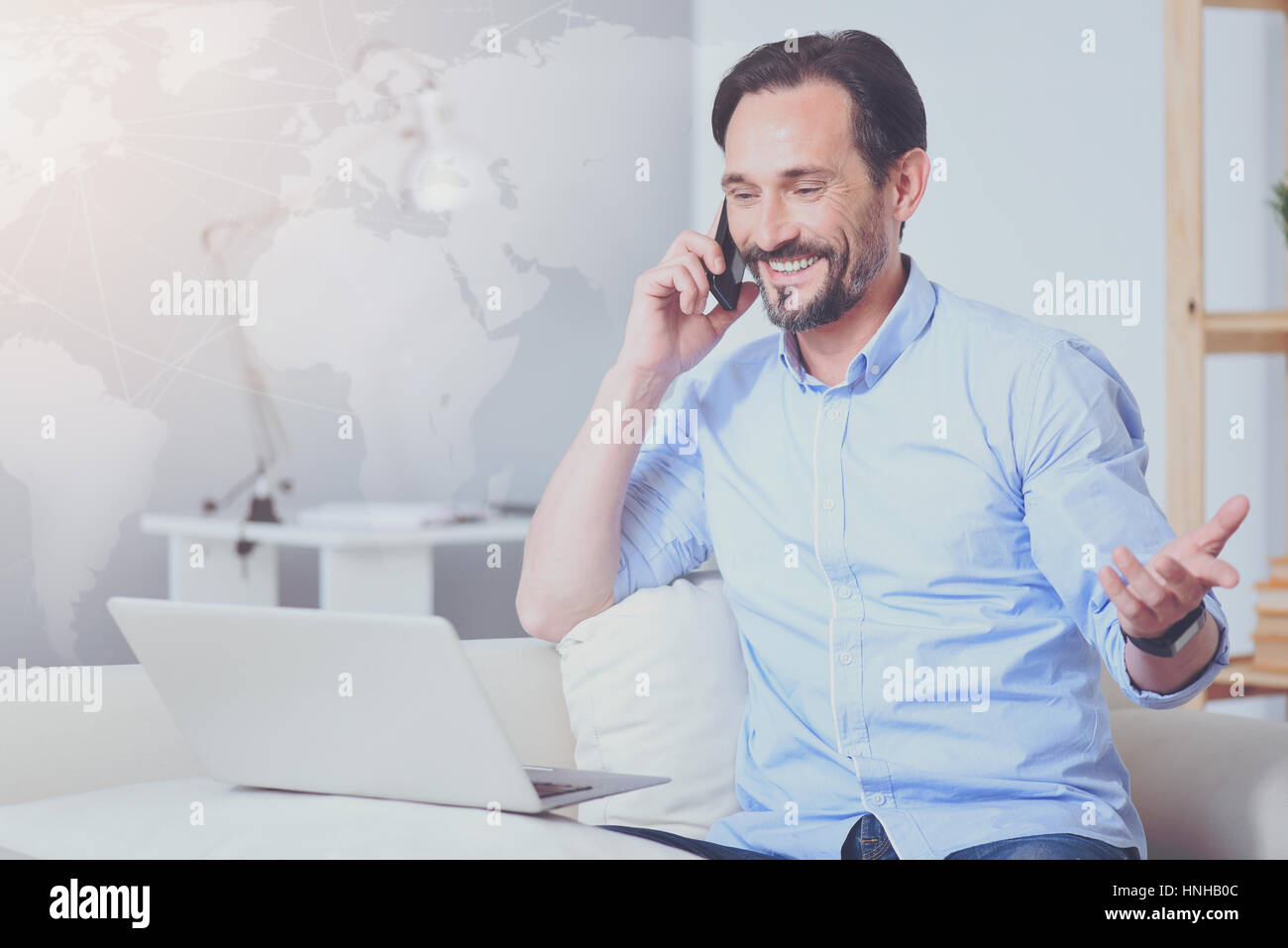 Positive man talking on cell phone Stock Photo - Alamy