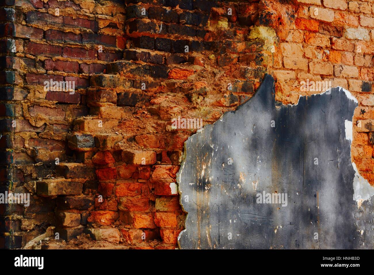Crumbling orange brick wall abstract Stock Photo - Alamy