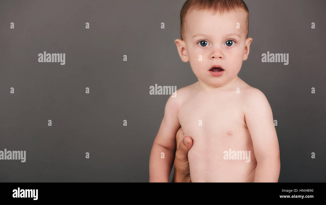 Happy baby being held hi-res stock photography and images - Alamy