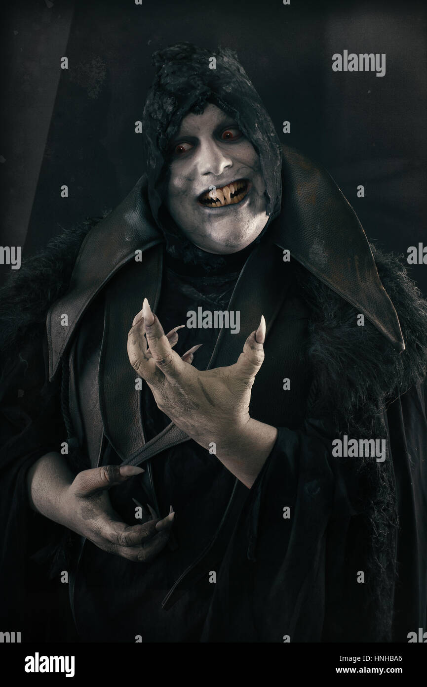 Happy crazy smiling nightmare vampire with large scary nails. Undead ...