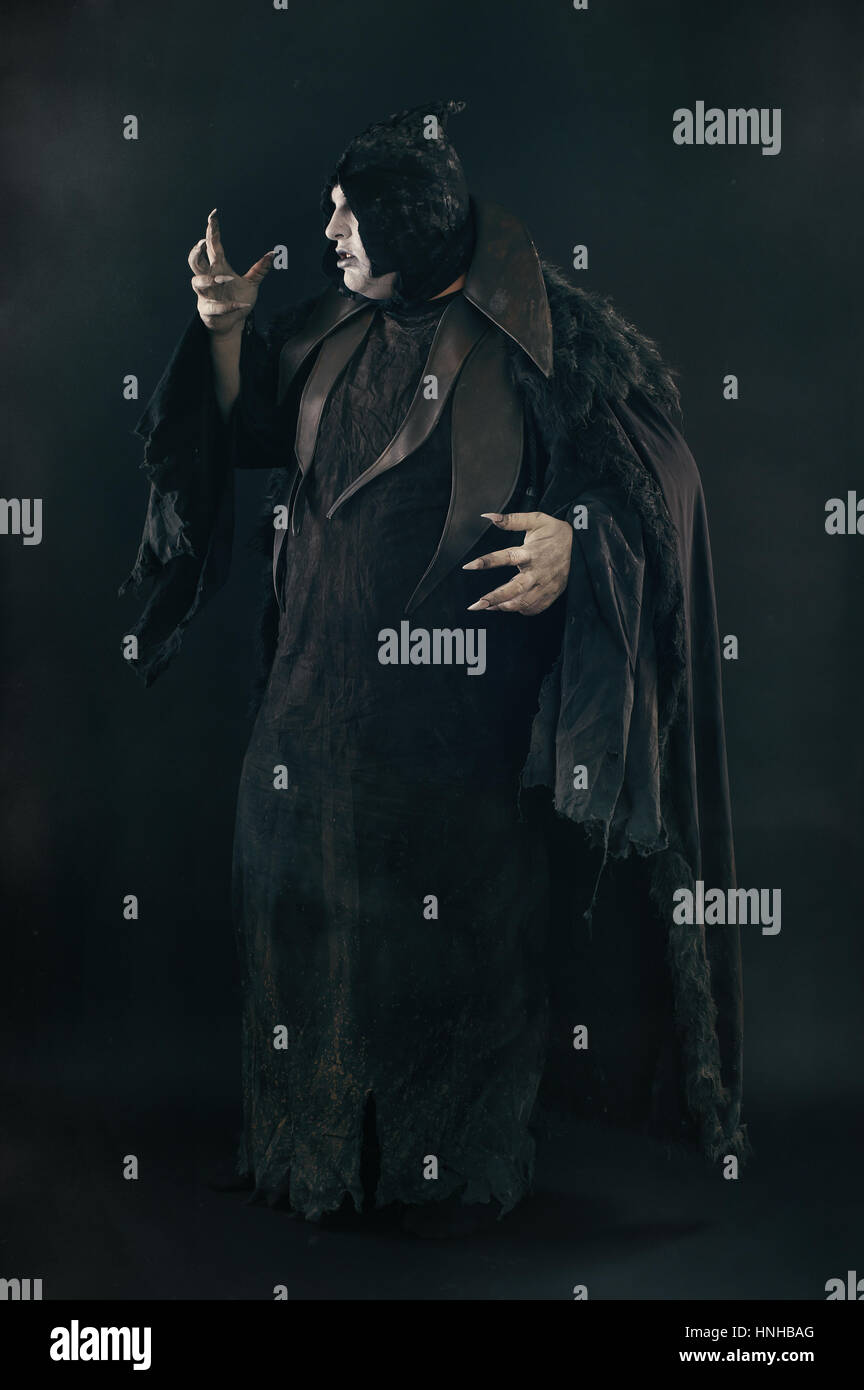 Spooky undead devil vamp with large scary nails. Hell and horror ...