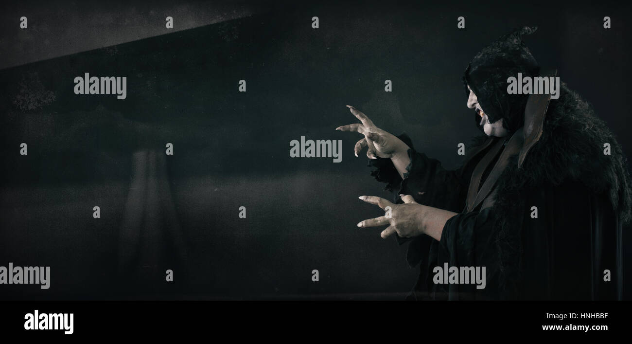 Spooky undead devil vamp with large scary nails. Hell and horror ...