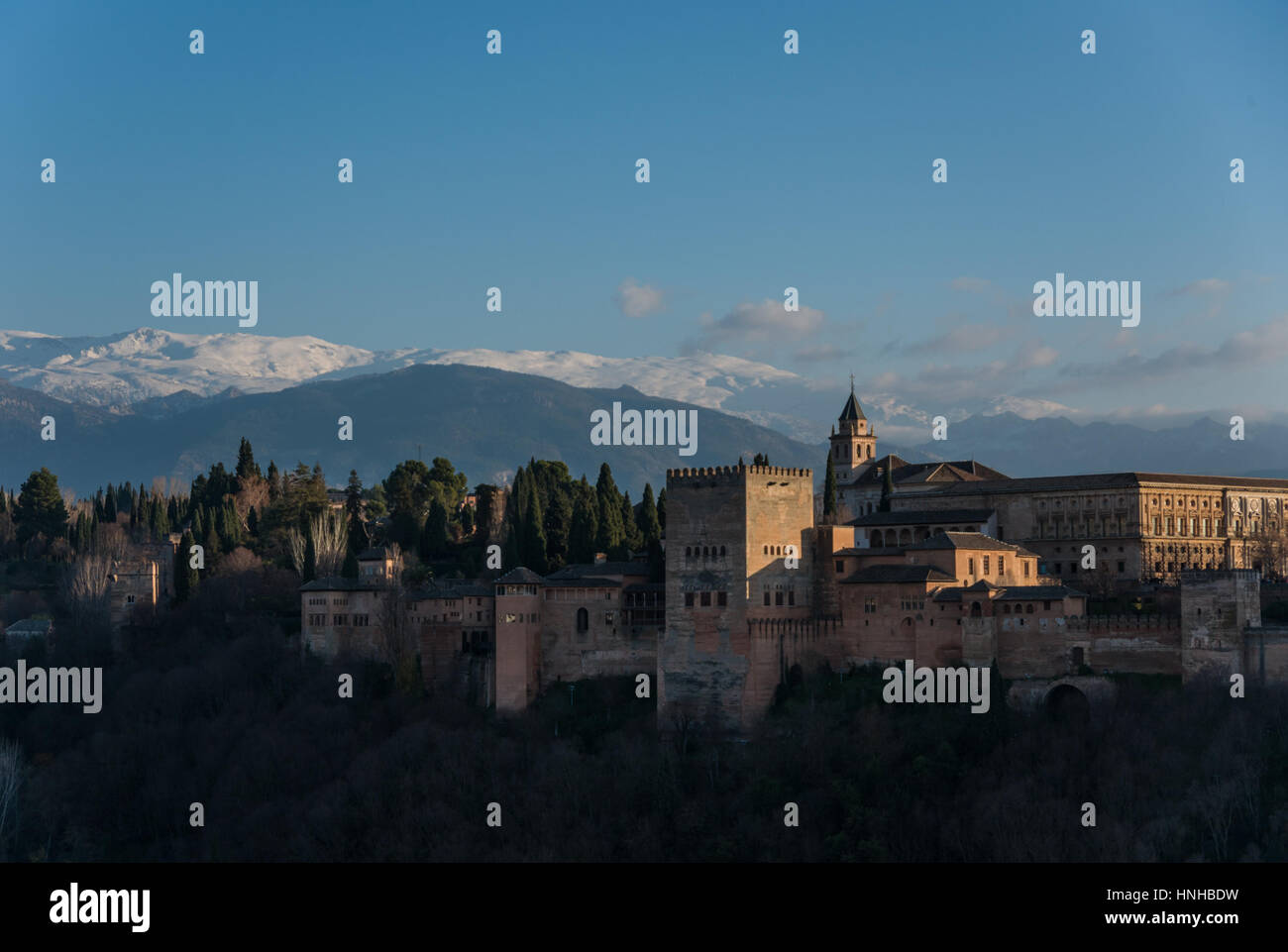 View of Alhambra Palace in Granada, Spain with Sierra Nevada mountains ...