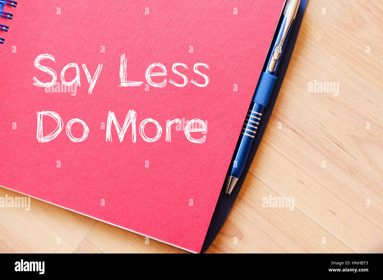 Say less do more text concept write on notebook Stock Photo - Alamy