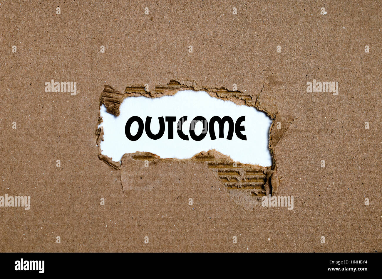The word outcome appearing behind torn paper Stock Photo - Alamy
