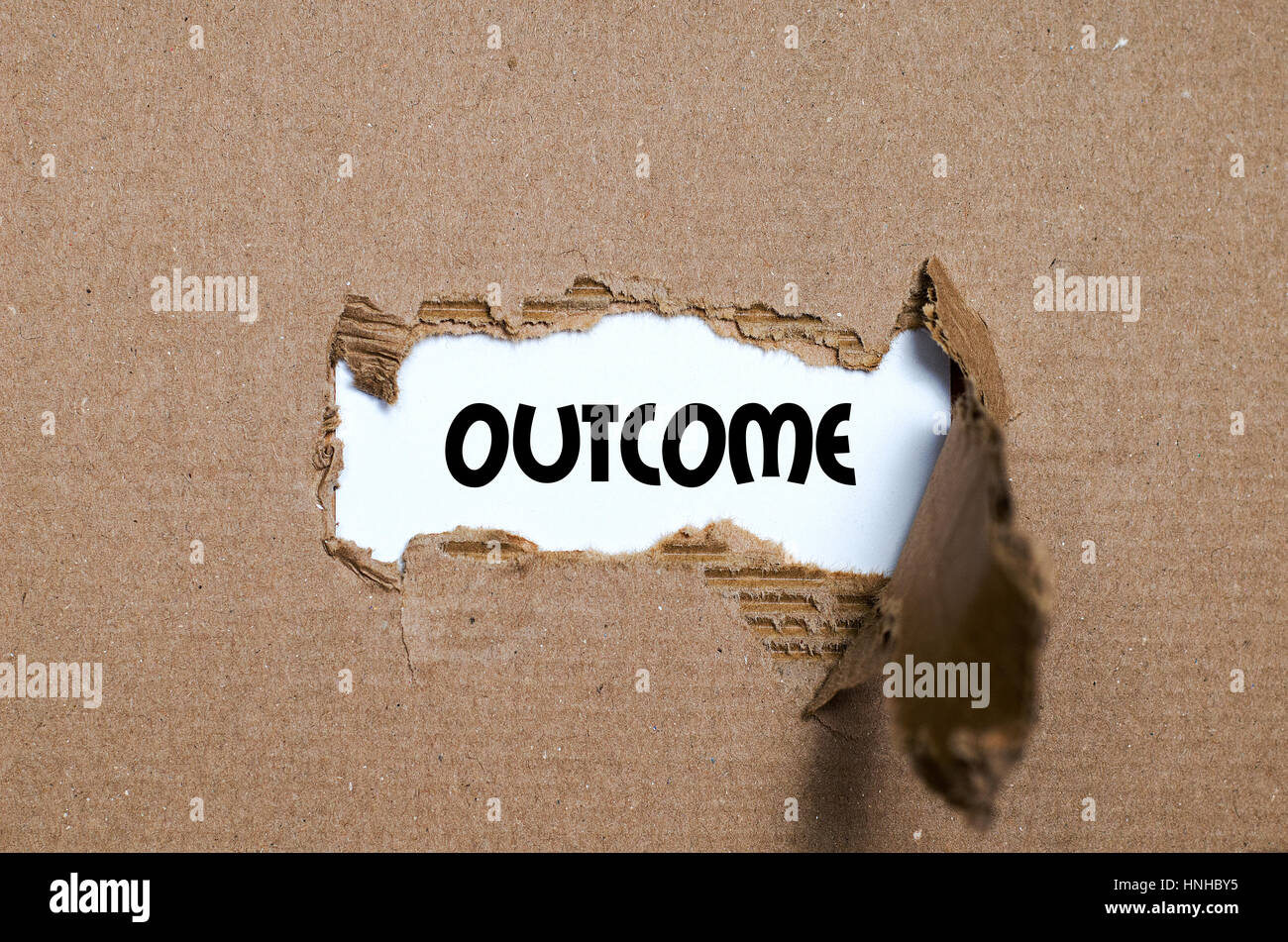 The word outcome appearing behind torn paper Stock Photo - Alamy