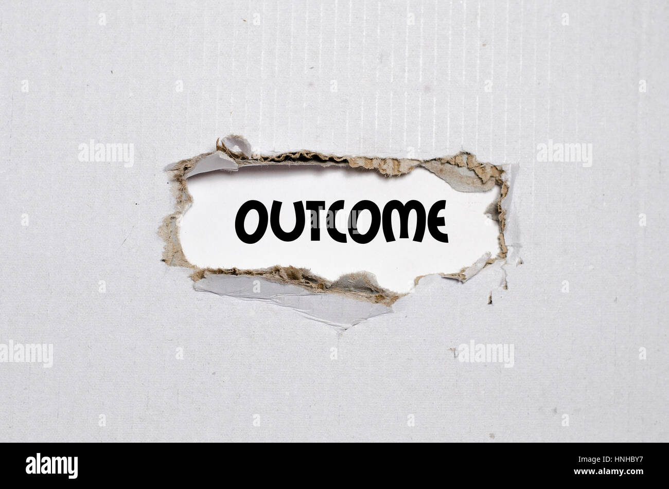 The word outcome appearing behind torn paper Stock Photo - Alamy