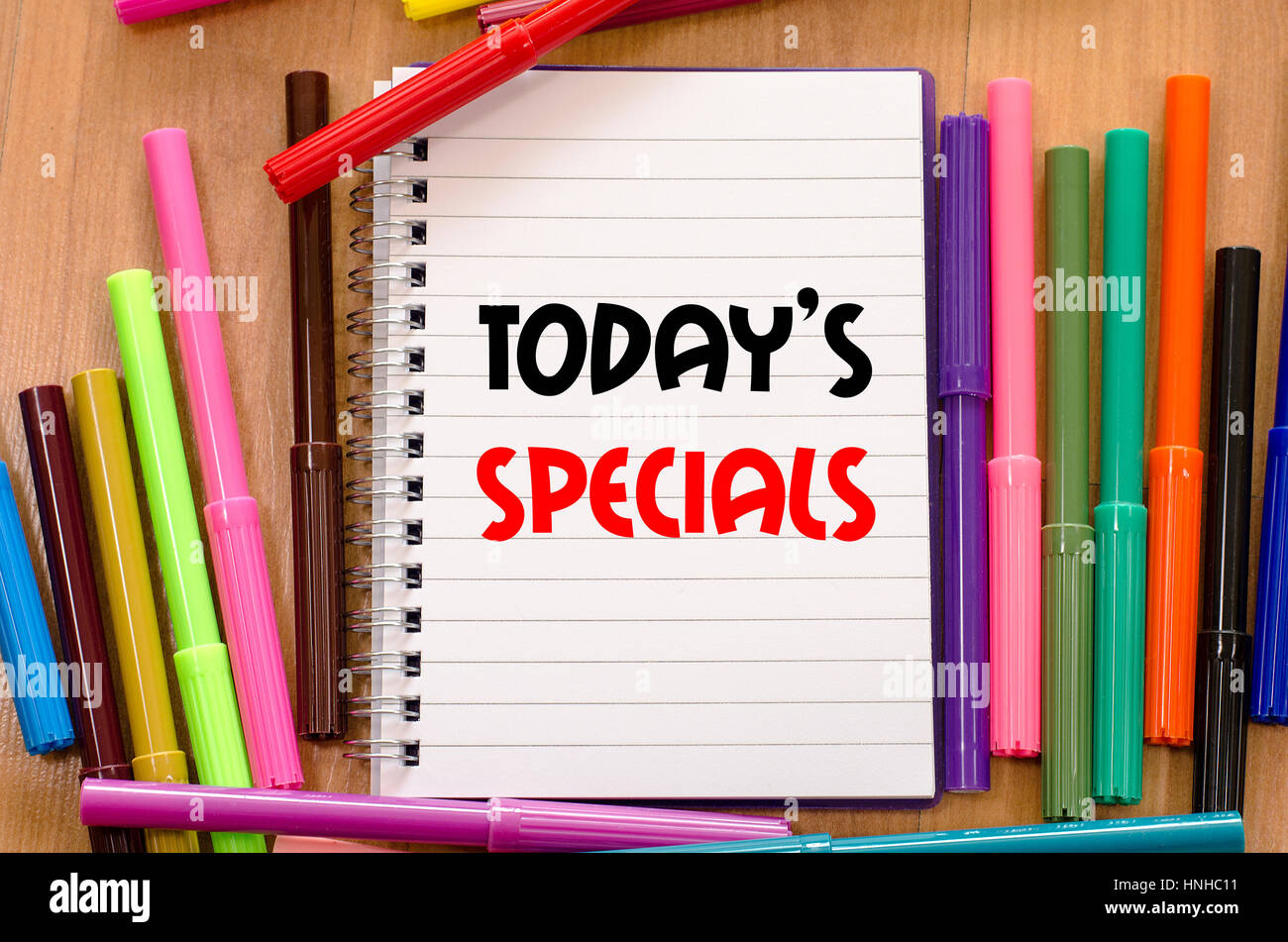 Felt-tip pen and notepad on a wooden background and text concept Stock ...