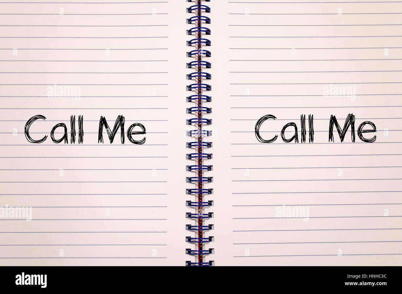 Call me text concept write on notebook Stock Photo - Alamy