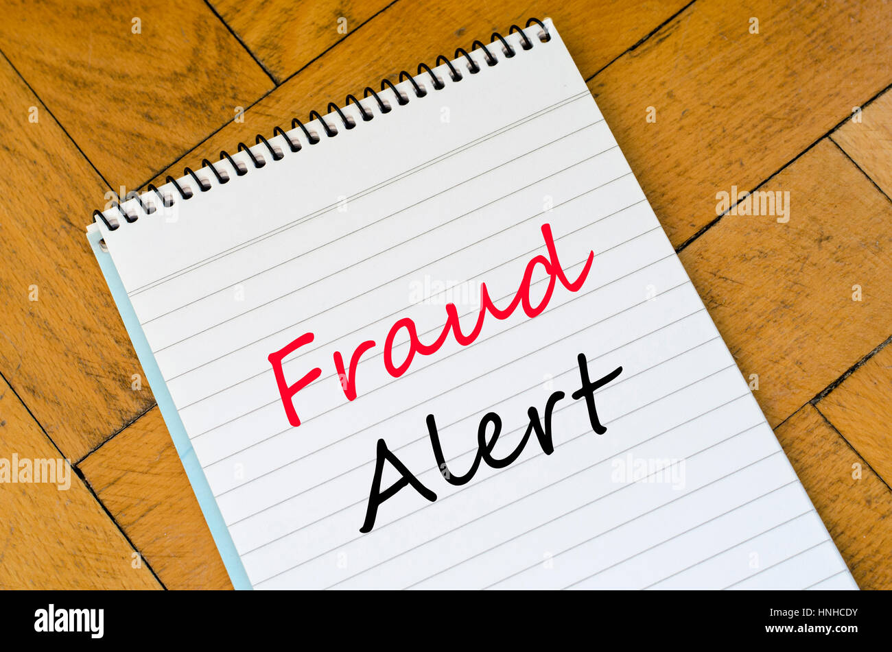 Fraud alert text concept write on notebook Stock Photo - Alamy