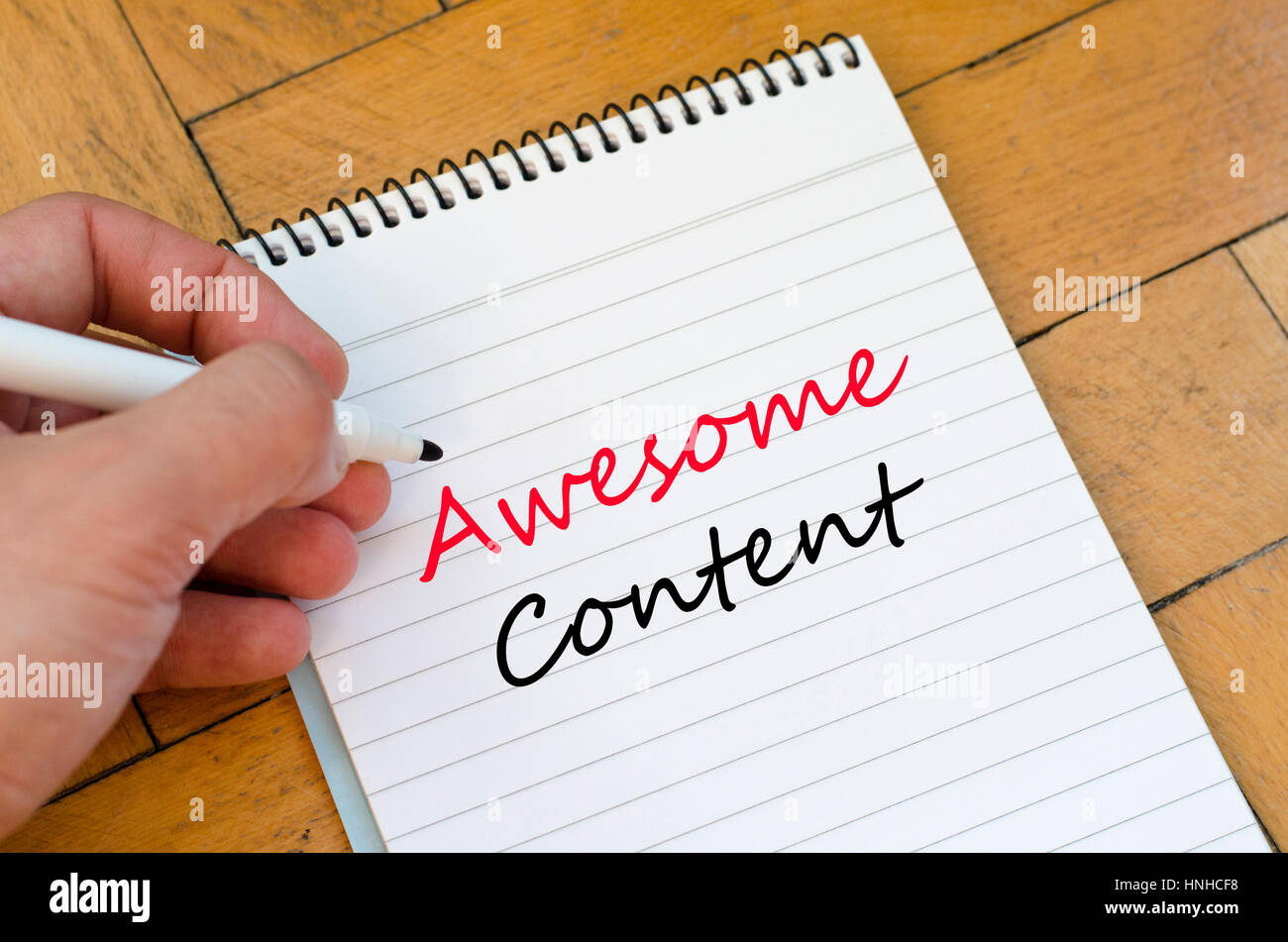 Awesome content text concept write on notebook Stock Photo - Alamy