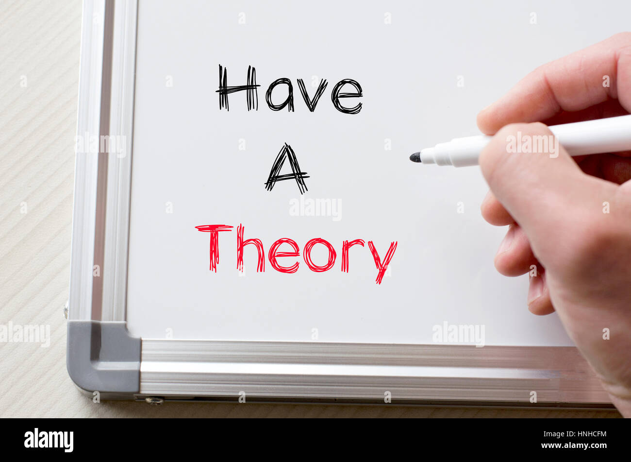 Human hand writing have a theory on whiteboard Stock Photo - Alamy