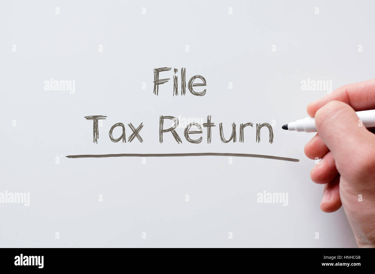 Human hand writing file tax return on whiteboard Stock Photo - Alamy