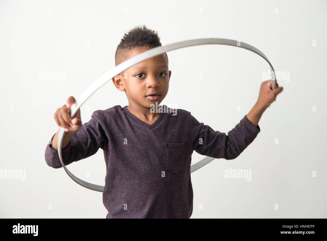 boy holding hoop Stock Photo - Alamy