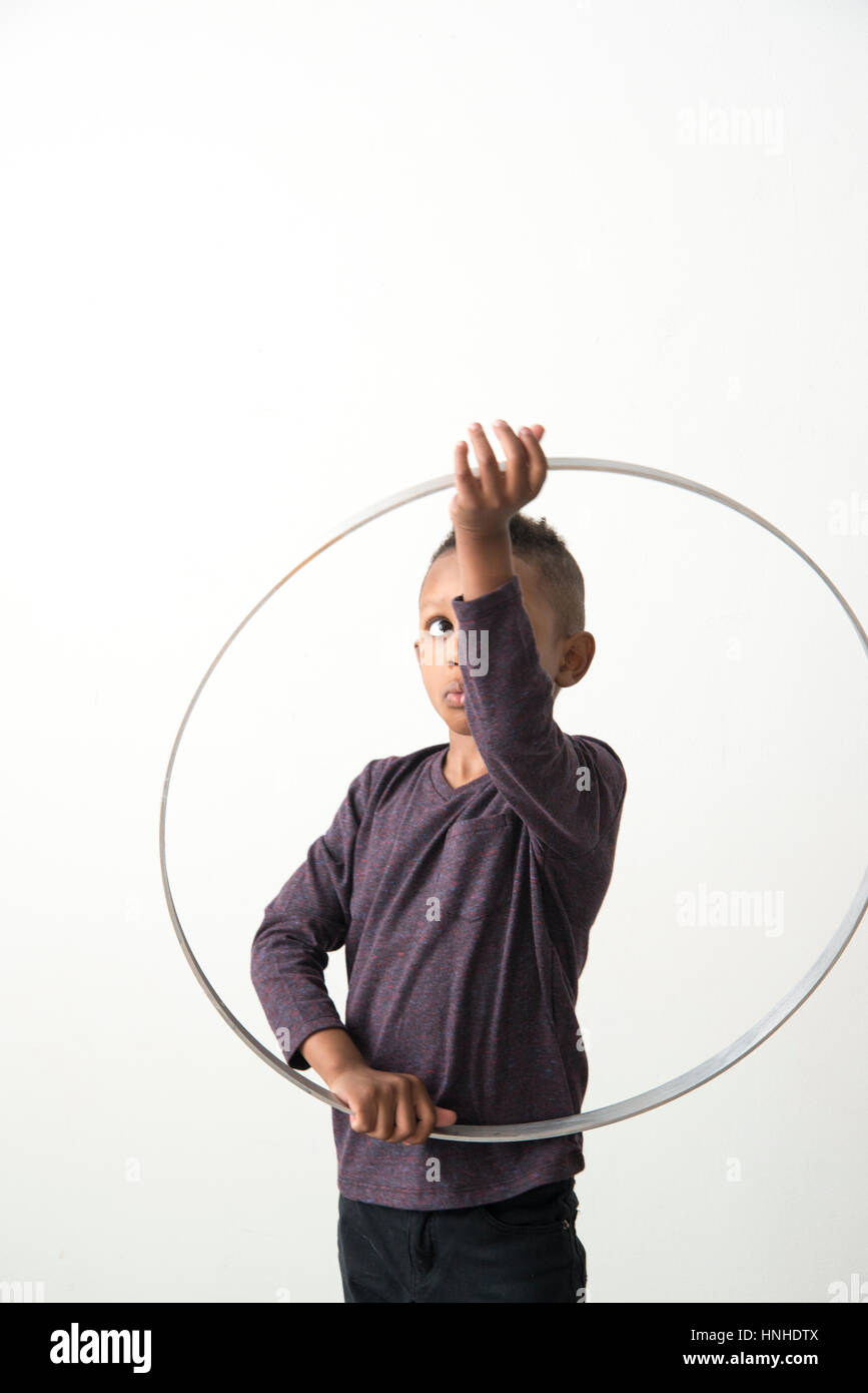 boy holding hoop Stock Photo - Alamy