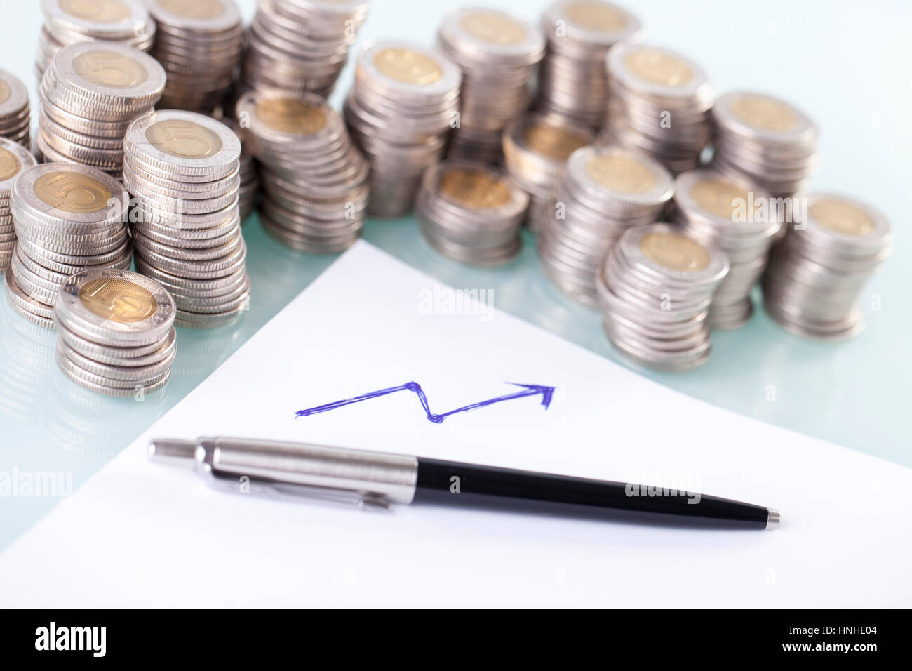 Financial theme on white background. Studio shot Stock Photo - Alamy