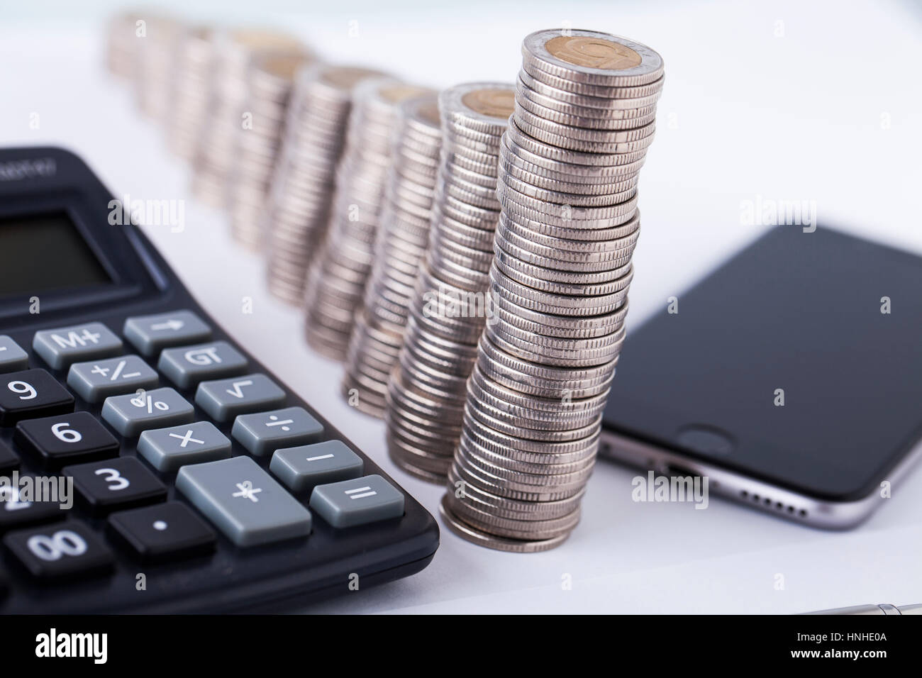 Financial theme on white background. Studio shot Stock Photo - Alamy