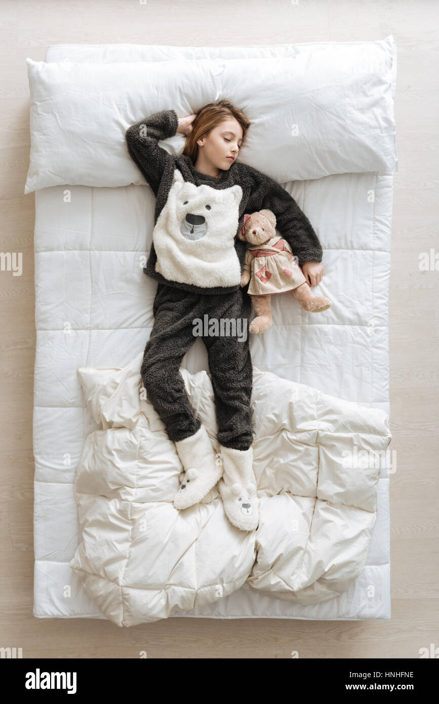Radiant pretty girl sleeping in fluffy pajamas Stock Photo - Alamy
