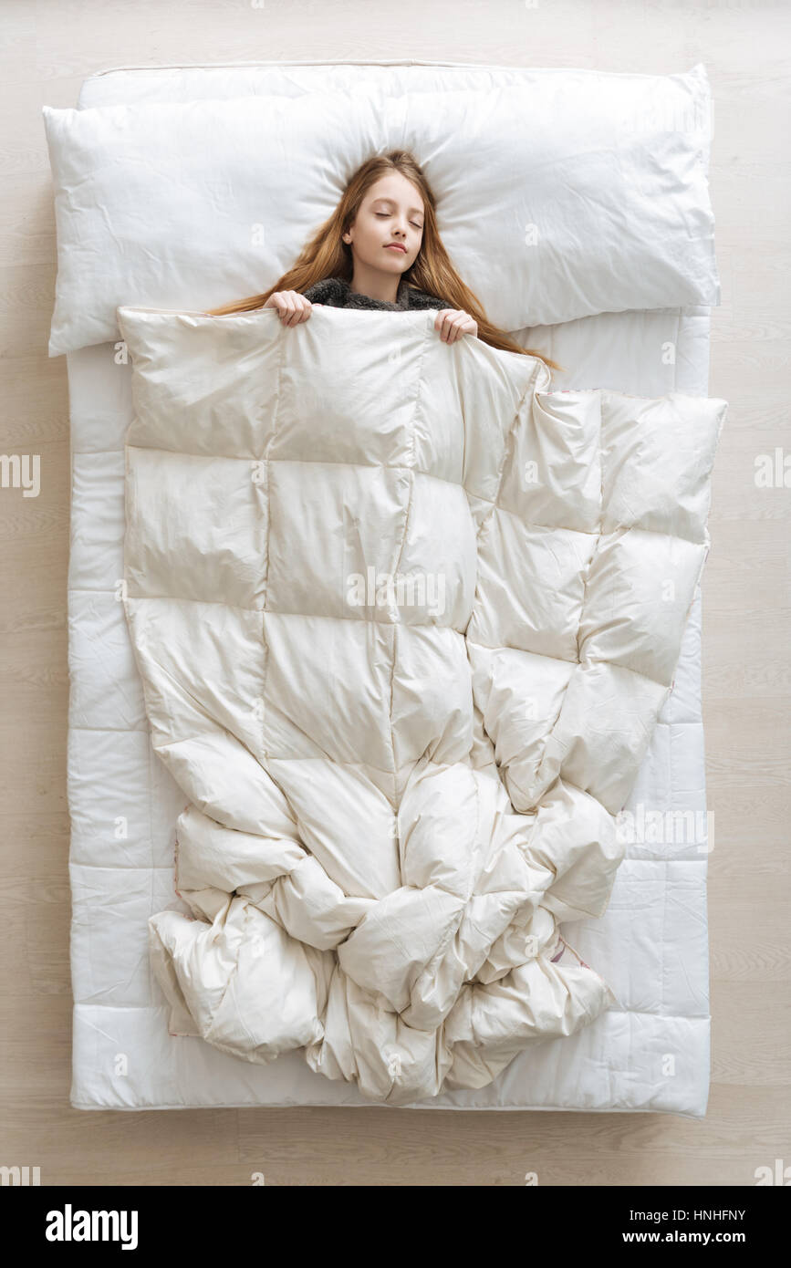 Relaxed cute child lost in a daydream Stock Photo - Alamy