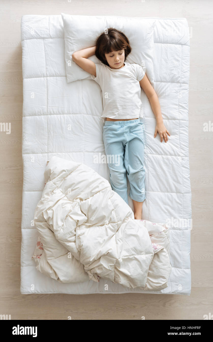 Cute little boy about to wake up Stock Photo - Alamy