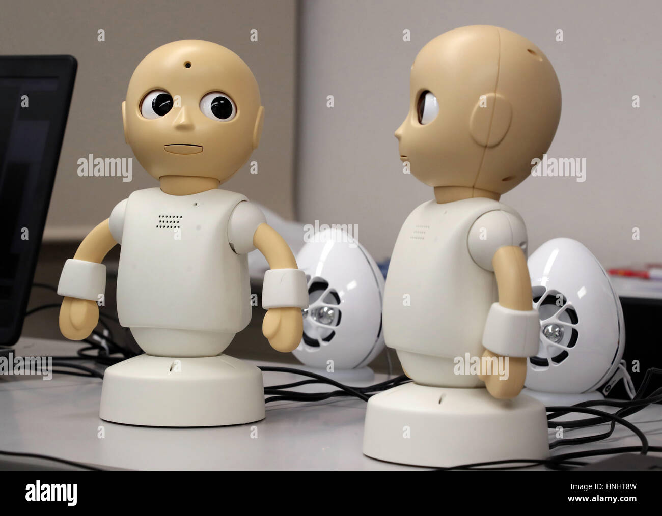 Tokyo, Japan. 13th Feb, 2017. Tiny twin robots "CommU" chat with user ...